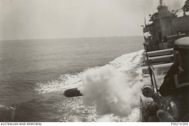 A TORPEDO BEING FIRED FROM THE PORT SIDE TORPEDO TUBES OF THE HMAS ...