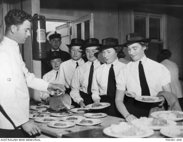 MESS LINE-UP FOR WRANS AT HMAS HARMAN ACT. C.1941 | Australian War Memorial