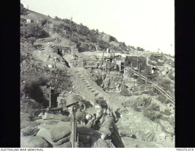 SERGEANT BILL MCGUINNES (WITH BOTTLE) AND LANCE CORPORAL JOE COLLIS. 3 ...