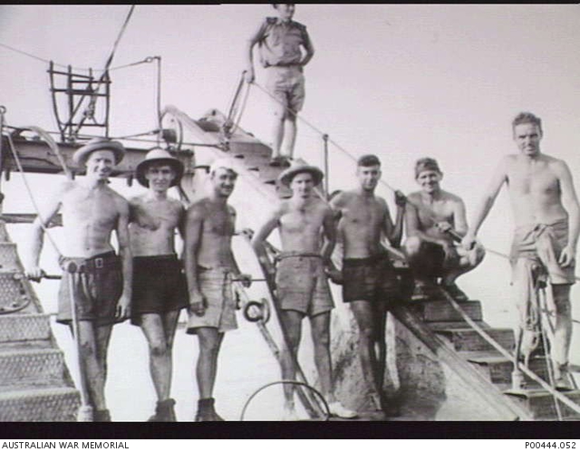 DARWIN, NT, 1943-03. SOME OF THE RIGGERS ON BOARD THE BOOM WORKING ...