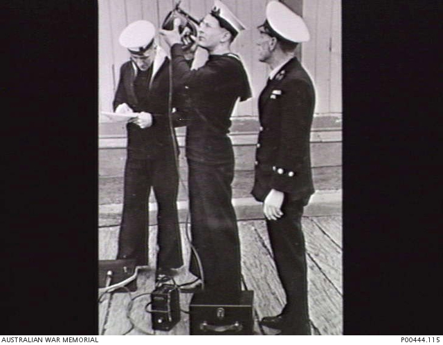FLINDERS NAVAL DEPOT, VICTORIA, 1940-07-27. RECRUITS PRACTISING SHIP TO AIR SIGNALLING AT THE ...