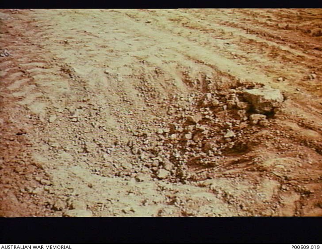 A HOLE LEFT WHEN A MINE - CLEARING TANK HIT A MINE WHILE A MINE ...