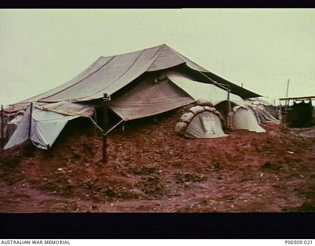 A FORTIFIED POSITION AT A FIRE SUPPORT BASE, PROTECTED FROM THE WEATHER ...