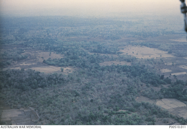 AERIAL VIEW OF THE AREA WHERE THE BATTLE OF LONG TAN WAS FOUGHT IN 1966 ...