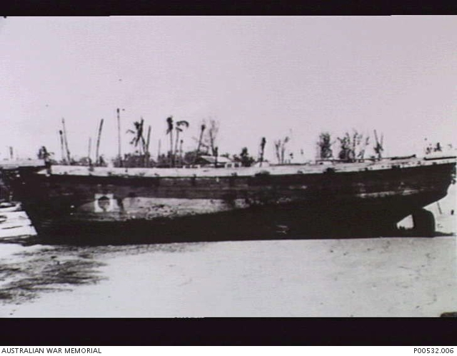 1945-09. BALIKPAPAN, DUTCH BORNEO. A JAPANESE BARGE ON THE BEACH ...
