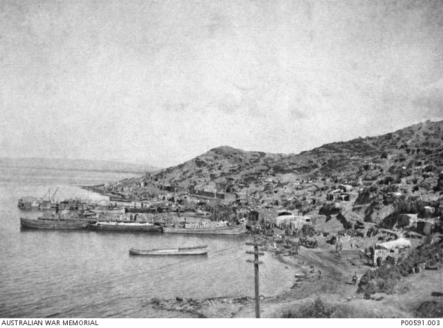 VIEW OF THE BEACH WHERE THE FIRST LANDINGS TOOK PLACE. SHOWS SHIPS ...