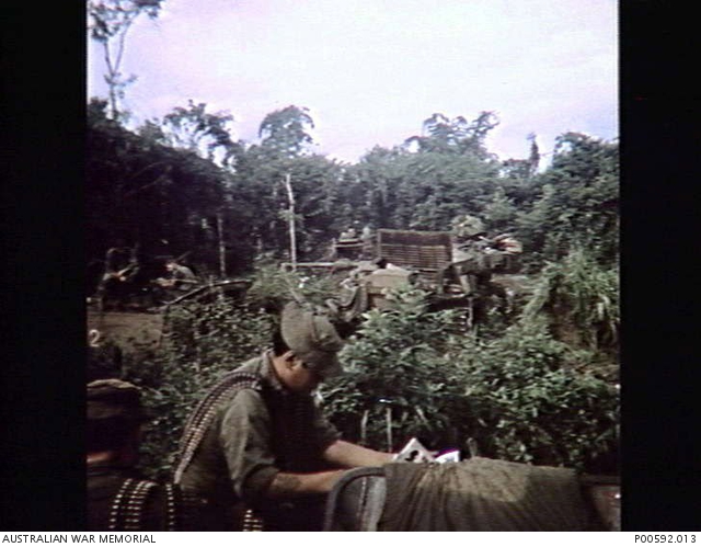 AUSTRALIAN AND NEW ZEALAND TROOPS TAKE A BREAK DURING AN OPERATION ON A ...