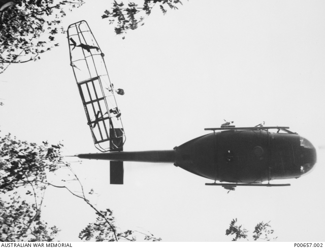 NUI DAT, SOUTH VIETNAM, C. 1970. STOKES LITTER BEING LOWERED FROM A ...