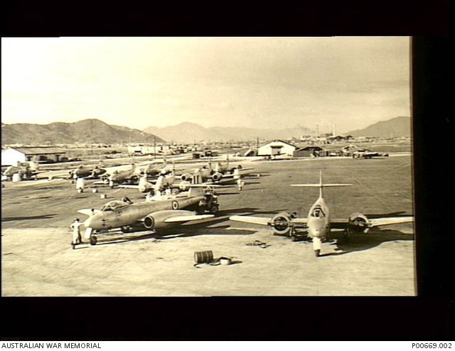 Iwakuni, Japan. 1954. Ground crew servicing Meteor aircraft of No. 77 ...