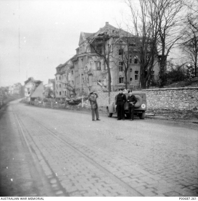 JOHN TOOHEY, JACK FLOWER AND JACK YOCOM SURVEY THE BOMB DAMAGE ...