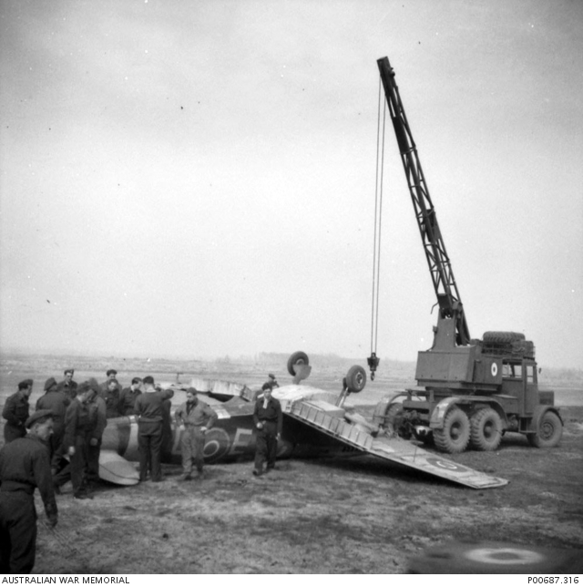 ENSCHEDE, HOLLAND, 1945-04. "RAISING A PRANGED 'PLANE". LARGE CRANE ...