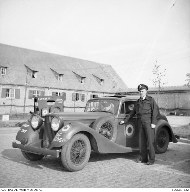 NORMAN STANDING BESIDE AN RAF SS JAGUAR CAR. Norman is most probably ...