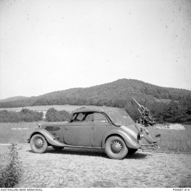 HERFORD, GERMANY, 1945-05. BMW MOTOR CAR, 88 MM GUN IN BACKGROUND (126. ...