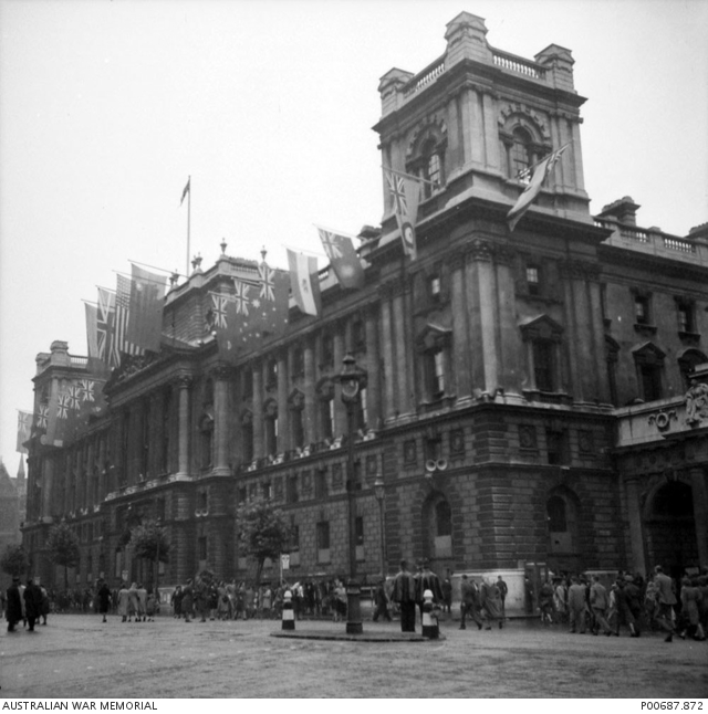 LONDON, ENGLAND, 1945-08. FLAG DRAPED BUILDING IN WHITEHALL ON V.E. DAY ...