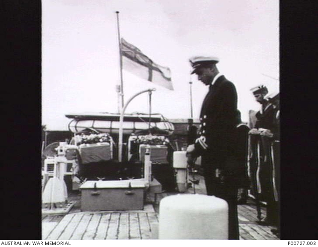 JAPAN, 1946. FUNERAL PARTY REST ON THEIR ARMS REVERSED AS THE CASKETS ...