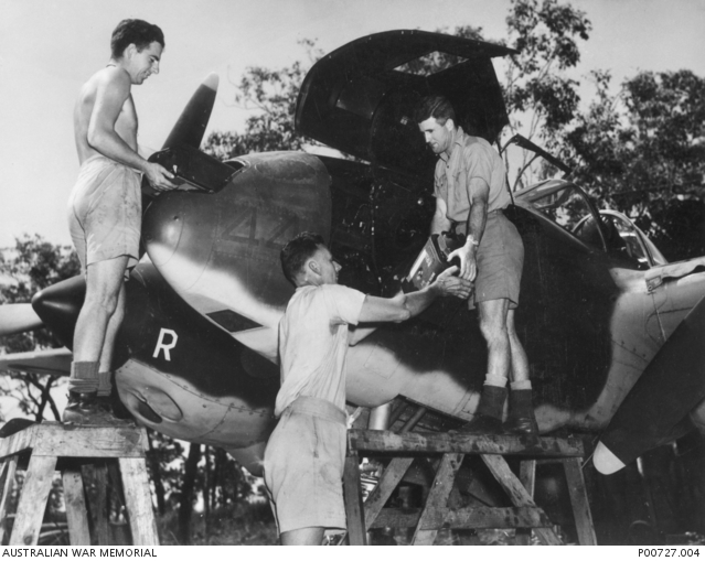 DARWIN AREA, NT, 1943. RAAF PERSONNEL LOADING CAMERA MAGAZINES IN A ...