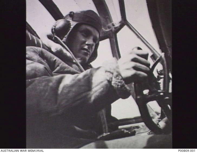 MIDDLE EAST, 1942. NO. 37 SQUADRON RAF PILOT IAN AT CONTROLS OF ...