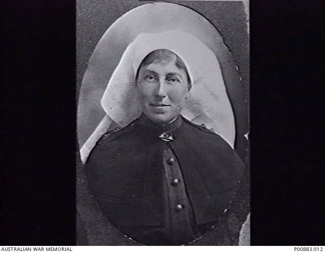 STUDIO PORTRAIT OF A MEMBER OF THE AUSTRALIAN ARMY NURSING SERVICE IN ...