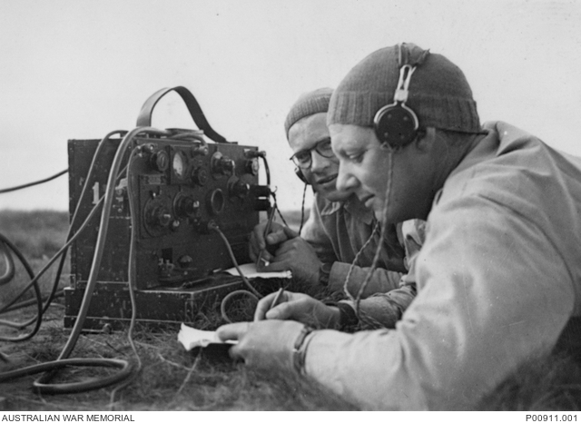 NX37175 PRIVATE HAROLD ABBOTT (FRONT) OPERATING A RADIO SET IN THE ...