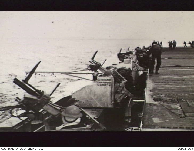 AT SEA. CREW AT THEIR POSTS ON DECK READY TO USE THE S2 OERLIKON ANTI ...