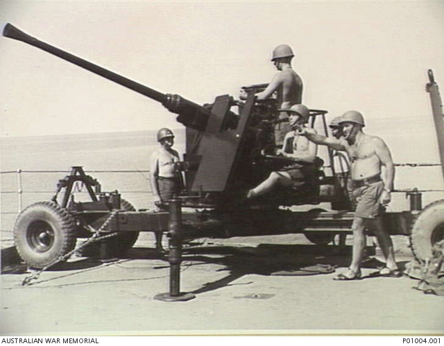 AN AUSTRALIAN ARMY ANTI-AIRCRAFT CREW WITH A 40MM BOFORS GUN MOUNTED ...
