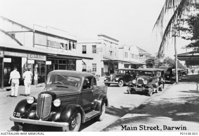 DARWIN, NT, C. 1941. A VIEW OF THE MAIN STREET SHOWING SHOPS, CARS ...