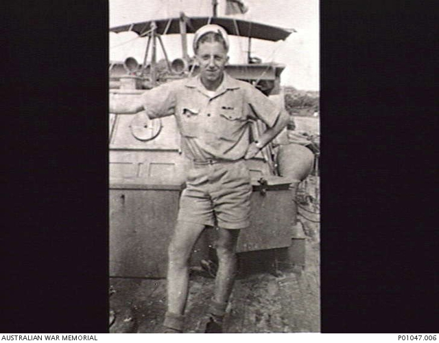 C. 1944. SEAMAN MICHAEL WHITE ON THE FOREDECK OF THE HARBOUR DEFENCE ...