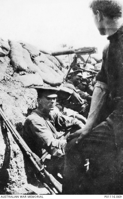 GALLIPOLI, C. 1915-08. A GROUP OF AUSTRALIAN SOLDIERS SIT IN A TRENCH ...
