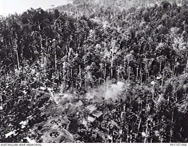 White dust from exploding 20mm cannon shells rising into the air as ...