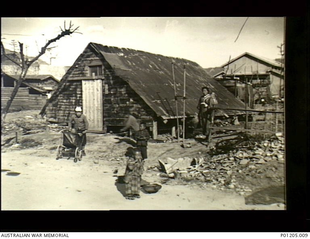 Kure, Japan. 1946-04. Makeshift housing constructed from scavenged ...