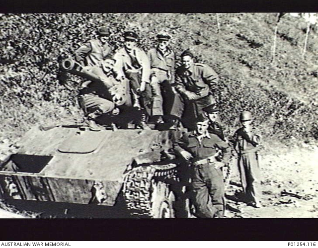 POHANG, SOUTH KOREA. 1950-11. NEAR POHANG, AN IMMOBILISED MOBILE GUN IS ...