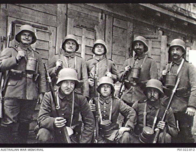 GROUP PORTRAIT OF EIGHT GERMAN INFANTRY SOLDIERS WITH EQUIPMENT ...