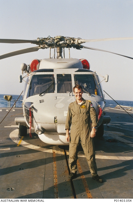 LIEUTENANT IAN PARROTT STANDING IN FRONT OF SEAHAWK HELICOPTER 874 (N24 ...