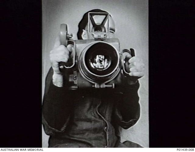 C. 1941. FRONT VIEW OF AN F24 AERIAL CAMERA, ITS USE BEING DEMONSTRATED ...