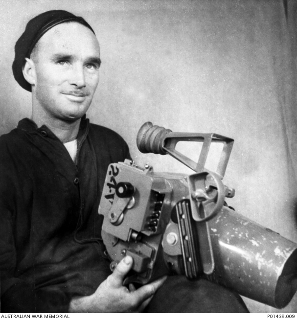 C. 1941. 35342 AIRCRAFTMAN 1 RICHARD (DICK) MORRIS HOLDING AN F24 ...