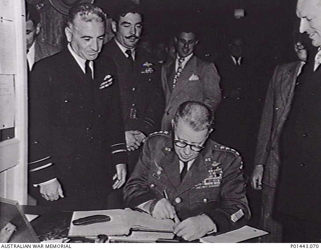 BRISBANE, QLD. 1950. GENERAL GEORGE C. KENNEY USAAF SIGNING THE ...