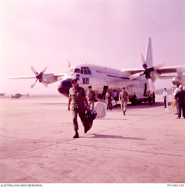 Members of the Australian Army Training Team Vietnam (AATTV) walking ...