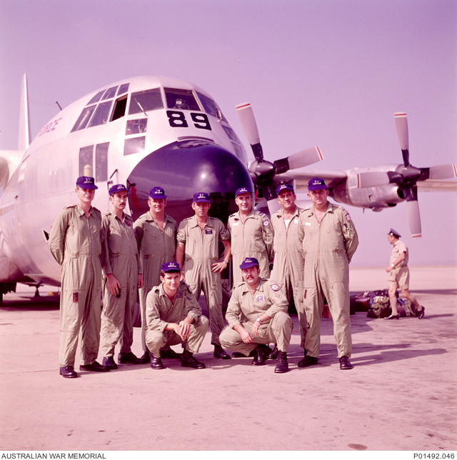 Members of 37 Squadron in front of an RAAF Hercules which withdrew ...