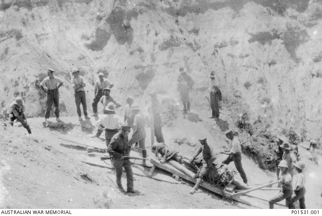 SOLDIERS HAUL THE BARREL OF A 6-INCH GUN UP WALKER'S RIDGE USING A SLED ...