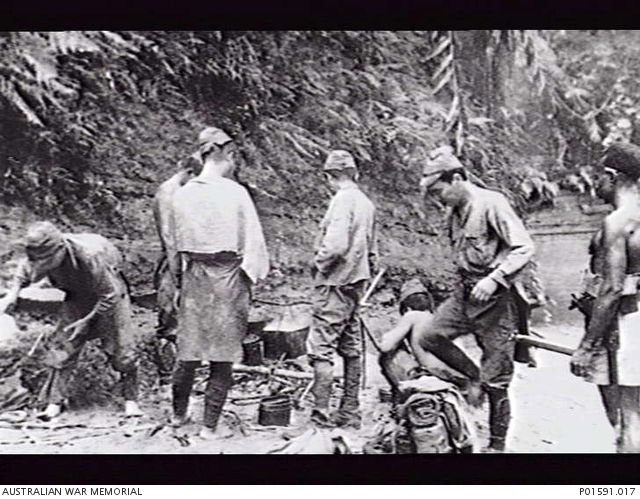PRINCE ALEXANDER RANGES, NEW GUINEA. 1945-08. A NATIVE OFFICER WITH ...