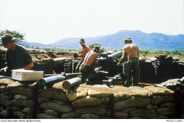 MEMBERS OF 101 FIELD BATTERY, ROYAL AUSTRALIAN ARTILLERY, LAYING A ...