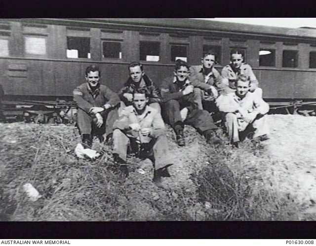 QLD. 1944-07. NO 20 SQUADRON RAAF PERSONNEL BESIDE THEIR TRAIN WHILE EN ...