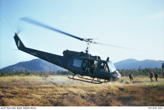 A UH-1B IROQUOIS HELICOPTER OF NO. 9 SQUADRON RAAF LIFTS OFF FROM A ...