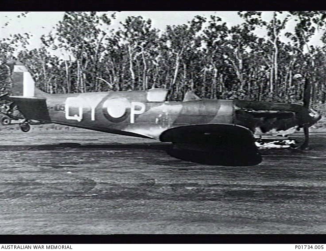 HUGHES AIRSTRIP, NT. 1943-12-11. BADLY DAMAGED SPITFIRE AIRCRAFT (?8 ...