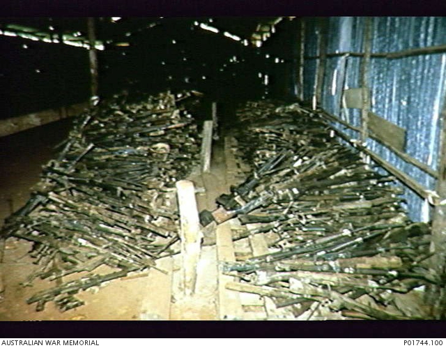 Cambodia, 1993-05-31. A huge collection of surrendered weapons piled up ...