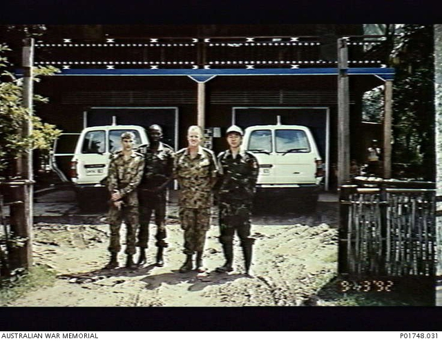 Group photograph of four members of the multinational United Nations ...