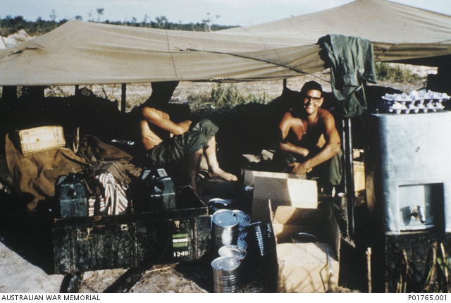 Two Australian soldiers sitting in a hoochie, a temporary canvas ...