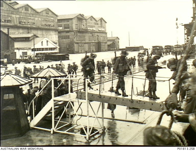 Kure, Japan, 1950-09-27. On a rainy day at Kure docks, members of the ...