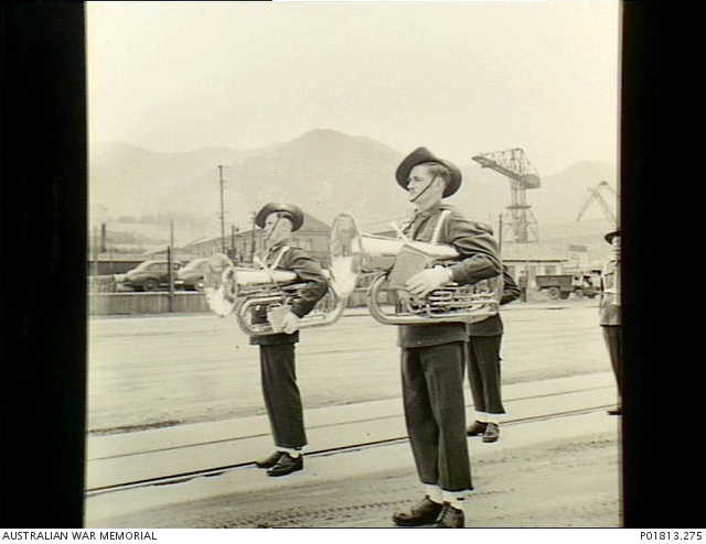 Kure, Honshu, Japan, 1949-03. Holding tubas or euphoniums under the ...