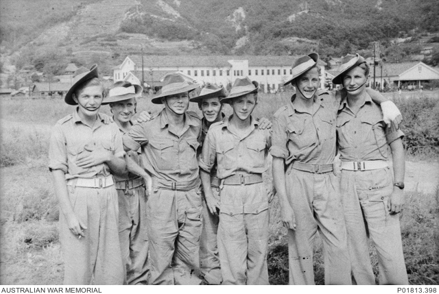 Hiro, Japan, c. 1950-09. Informal outdoors group portrait of members of ...